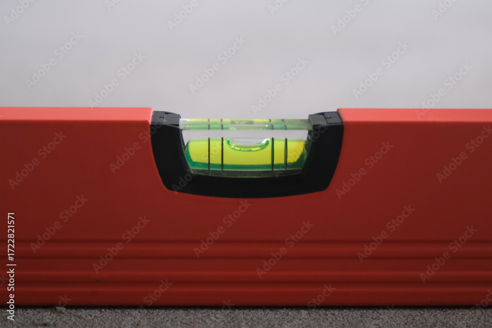 Red balance ruler, measurement horizontal deviation of construction ...