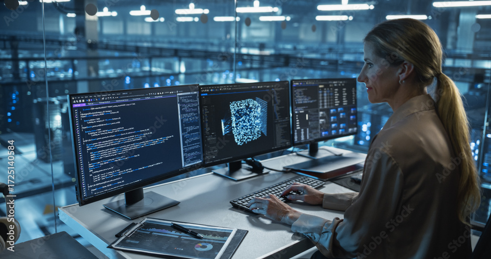 Stock-Foto „Female Developer Typing Software Code, Managing Several Open Screens Showing Editors ...