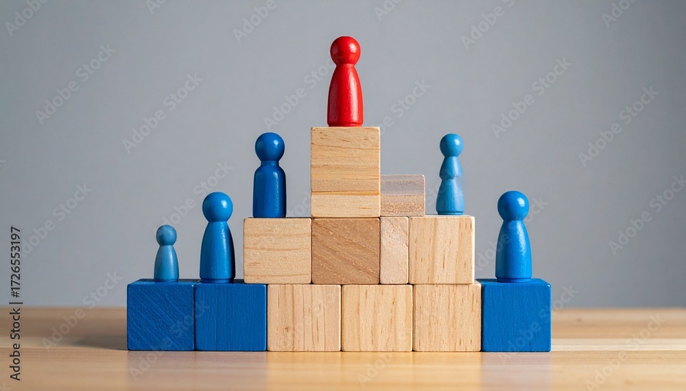 Pyramid of wooden blocks with red and blue game pieces—evoking ...