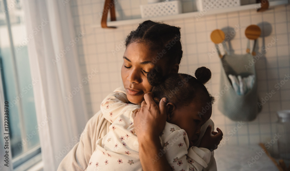 Mother embracing her young child Stock Photo | Adobe Stock