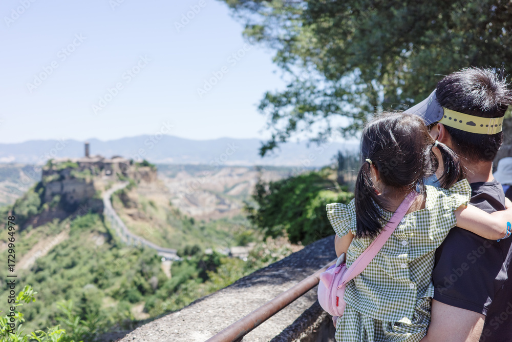Asian Tourist Father Holding Daughter Looking at the Scenic Civita di ...