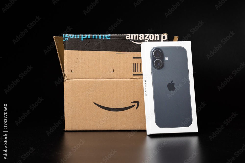 Apple iPhone 17 packaging box leaning against Amazon shipping box on September 20, 2025 in ...