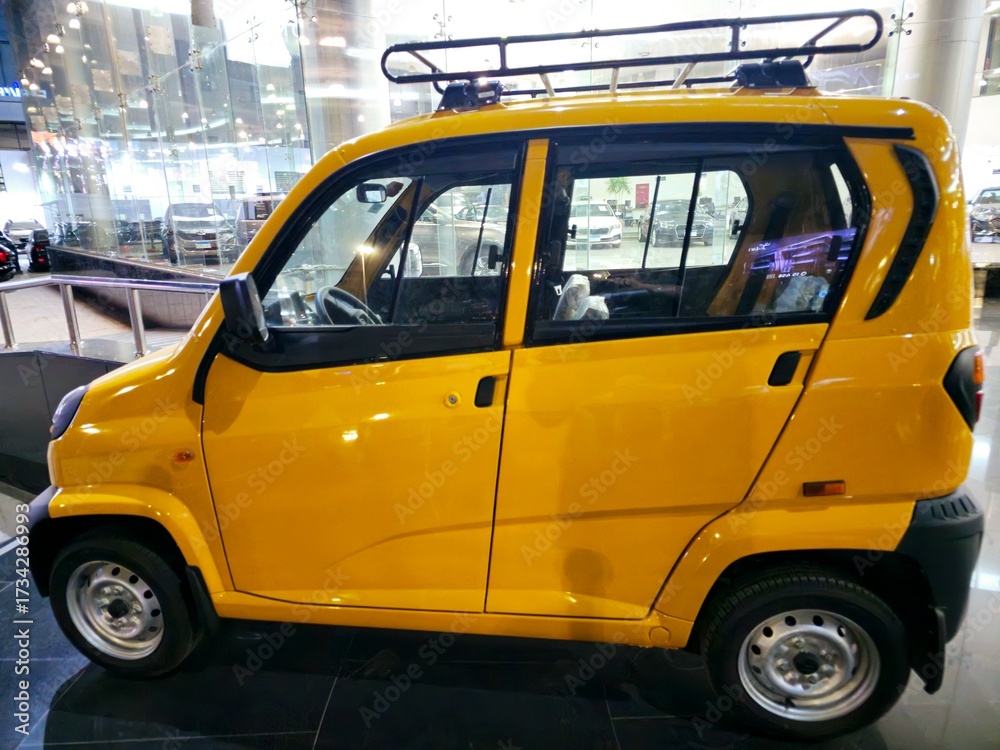 Cairo, Egypt, September 29 2025: Yellow color The Bajaj Qute, India's ...