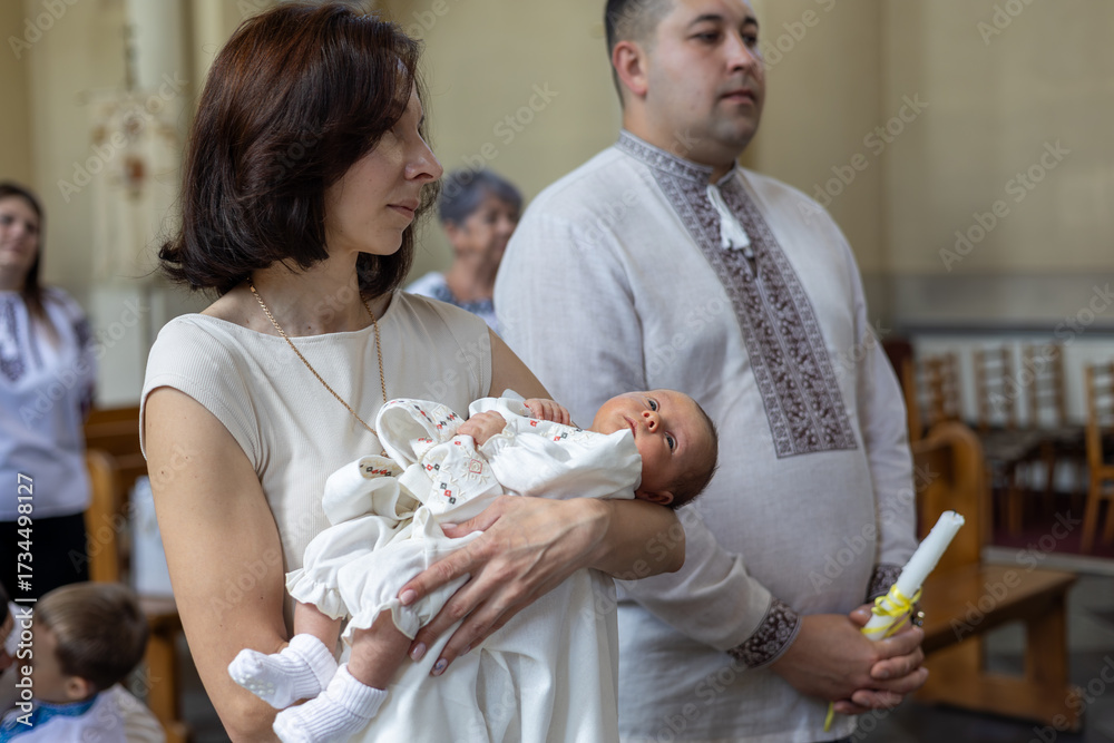 Priest reading prayers during christening ceremony in Greek Catholic ...
