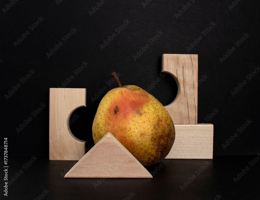 Still life with a pear and wooden blocks Stock Photo | Adobe Stock