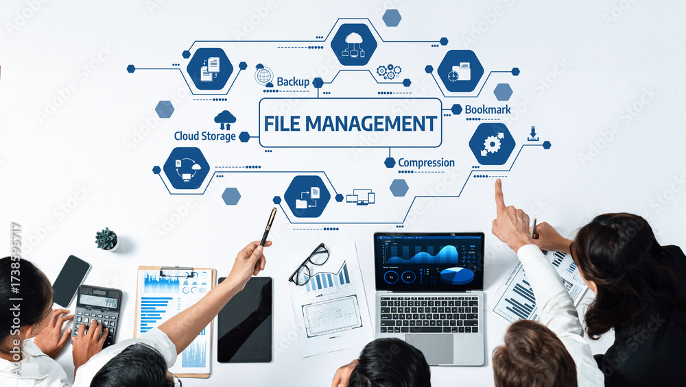 A diverse business team collaborates on innovative file management ...