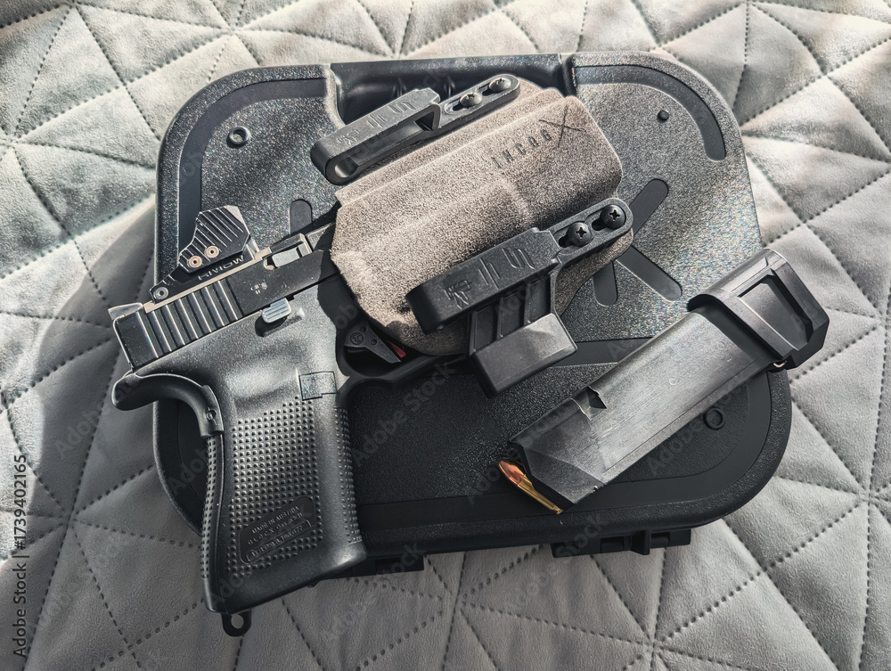 BALTIC REGION - OCTOBER 3, 2025: A flat lay of a Glock pistol with ...