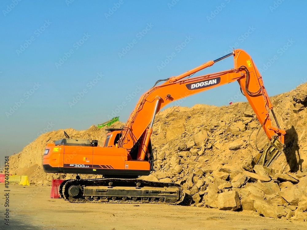 Cairo, Egypt, September 30 2025: Doosan hydraulic excavator removing ...