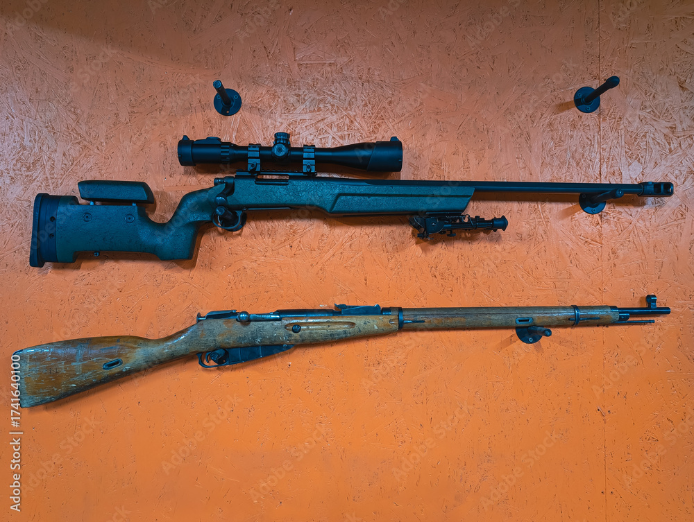 BALTICS - OCTOBER 04, 2025: Old and new rifle technology contrasted ...