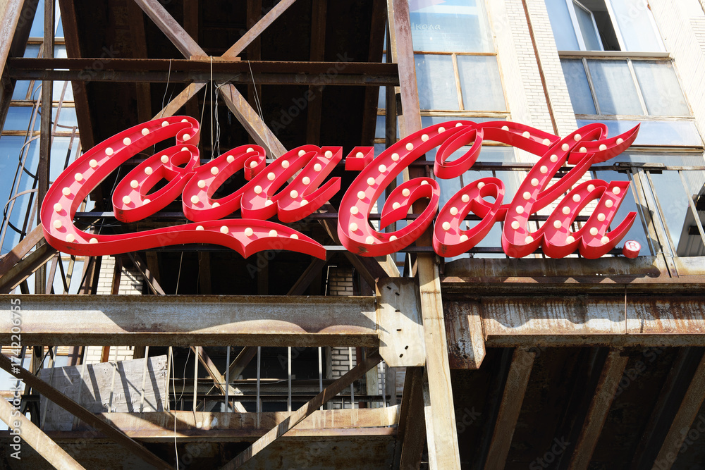Minsk, Belarus - April 10, 2025: Iconic Coca-Cola sign illuminated on ...