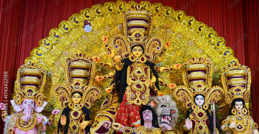 Colorful idols of Goddess Durga with Lakshmi, Saraswati, Kartikeya, and ...