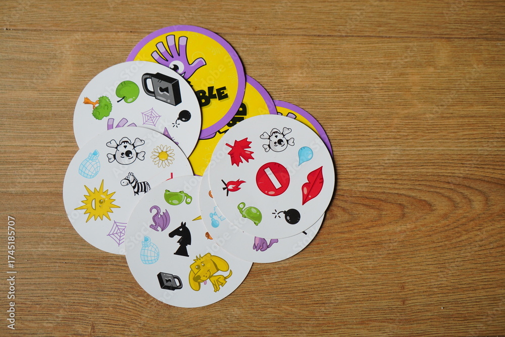 The popular card game 'Dobble', also known as 'Spot It!', with its ...