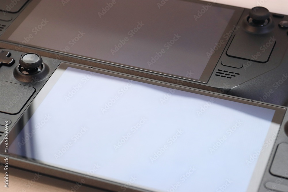 Two portable gaming devices (game consoles) side by side: a comparison ...