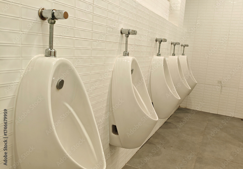 Men's public restroom, row of urinals, white urinals in the men's restroom Stock Photo | Adobe Stock