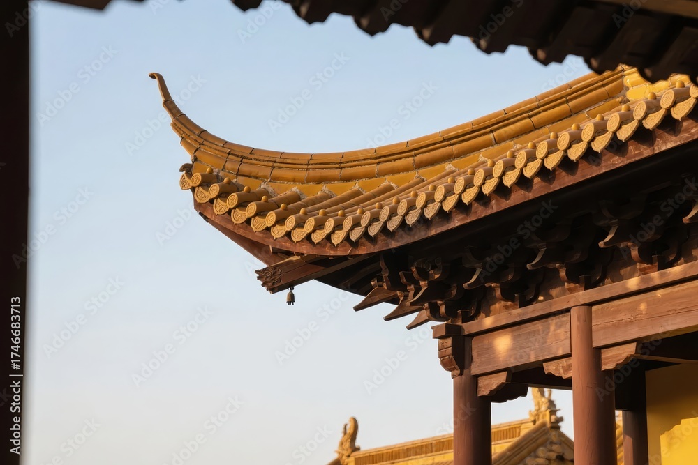 Traditional Chinese architectural roof with upturned eaves and golden ...