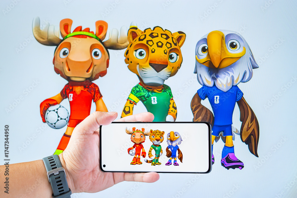 ZHONGSHAN China-October 9 2025: a mobile and a monitor of official ...