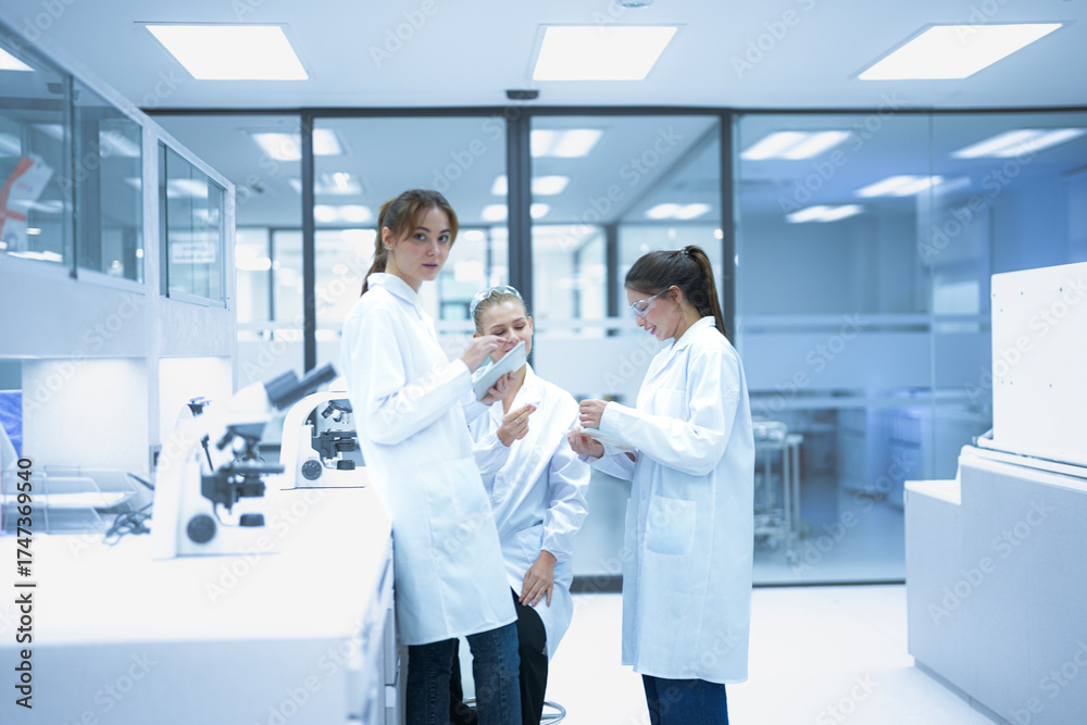 Researchers in a state of the art R and D institute discuss their ...