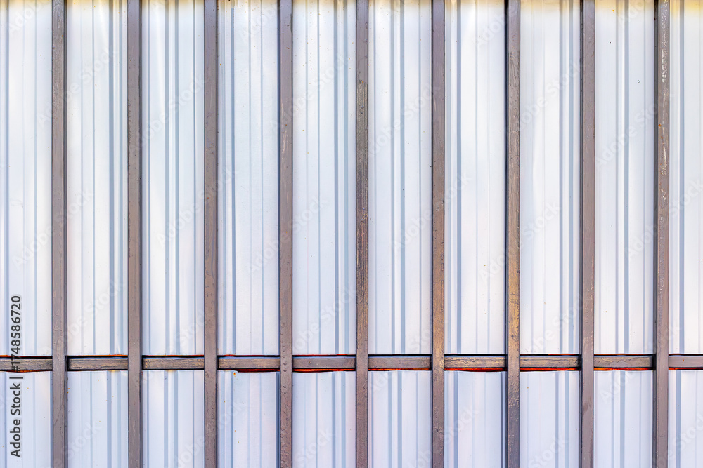 Metal bars on industrial warehouse wall background with vertical lines ...
