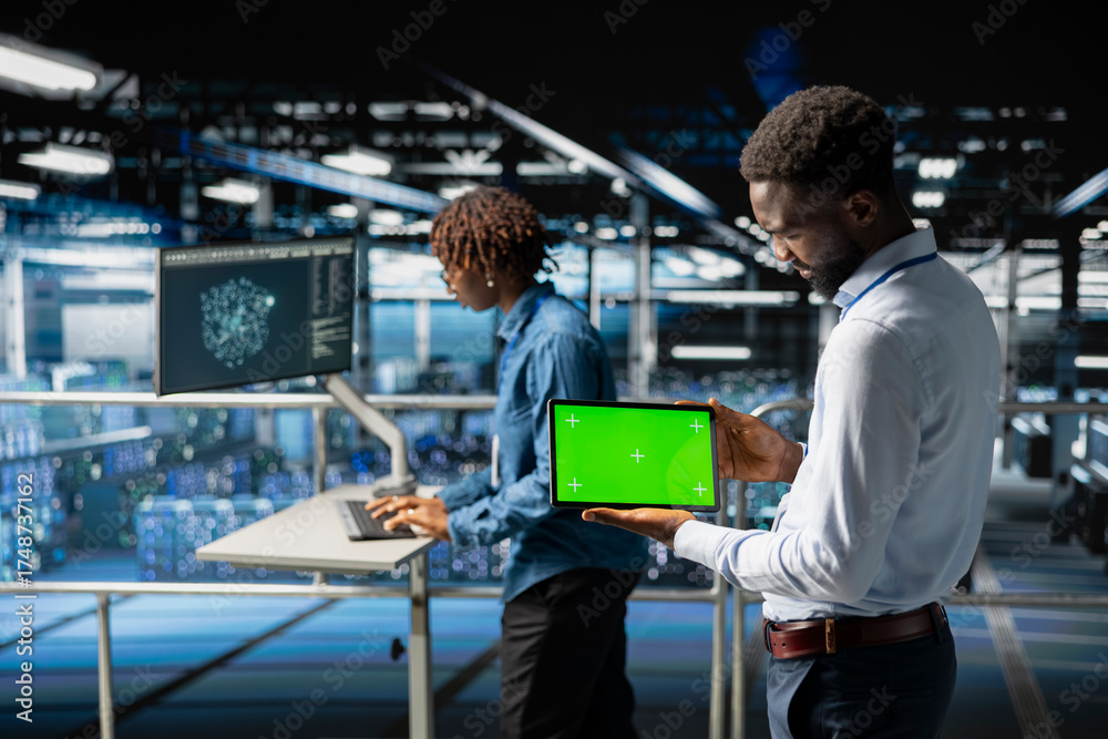 Black male technician using mockup screen on tablet to analyze neural ...