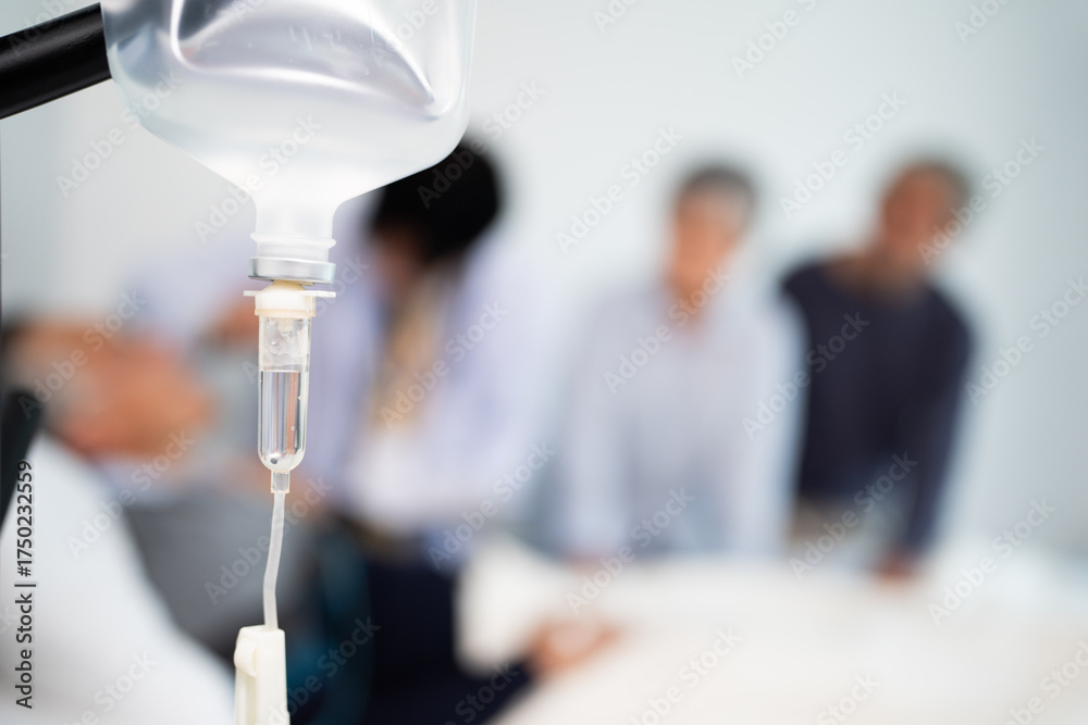 Closed up hanging saline solution bottle in emergency room at hospital ...