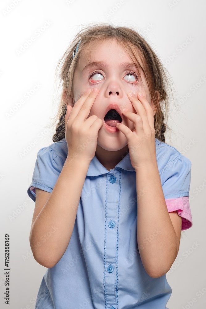 Young girl with surprised expression, eyes wide open, mouth agape ...