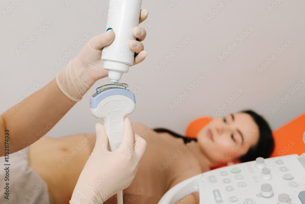 Stock-Foto „Applying gel to the ultrasound device eliminates air gaps ...