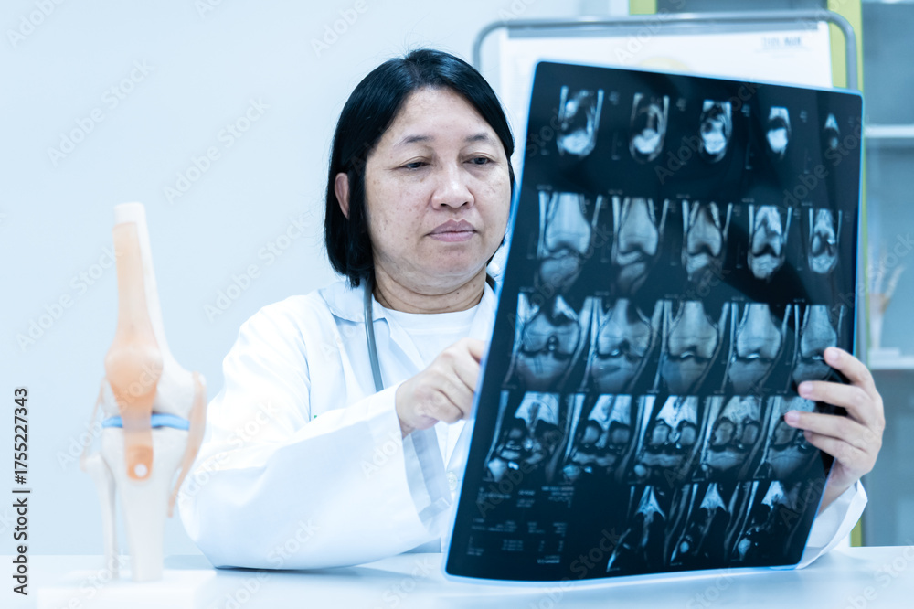 Doctor holding patient bone x-ray film before surgery.Image MRI and CT ...