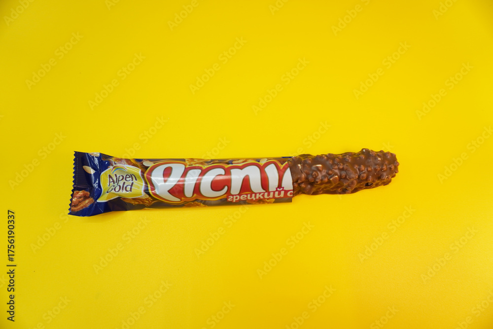 A picnic chocolate bar is partially removed from its packaging on a ...