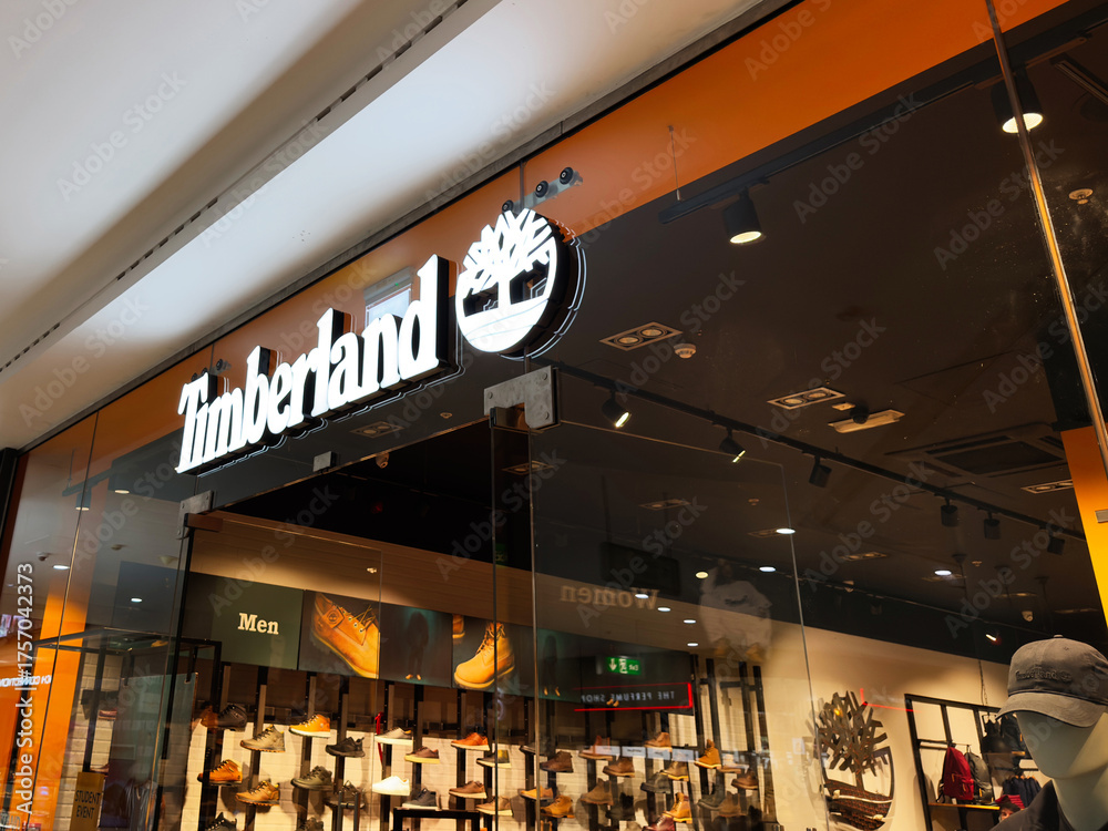 Timberland store front with illuminated sign and boot displays inside a ...