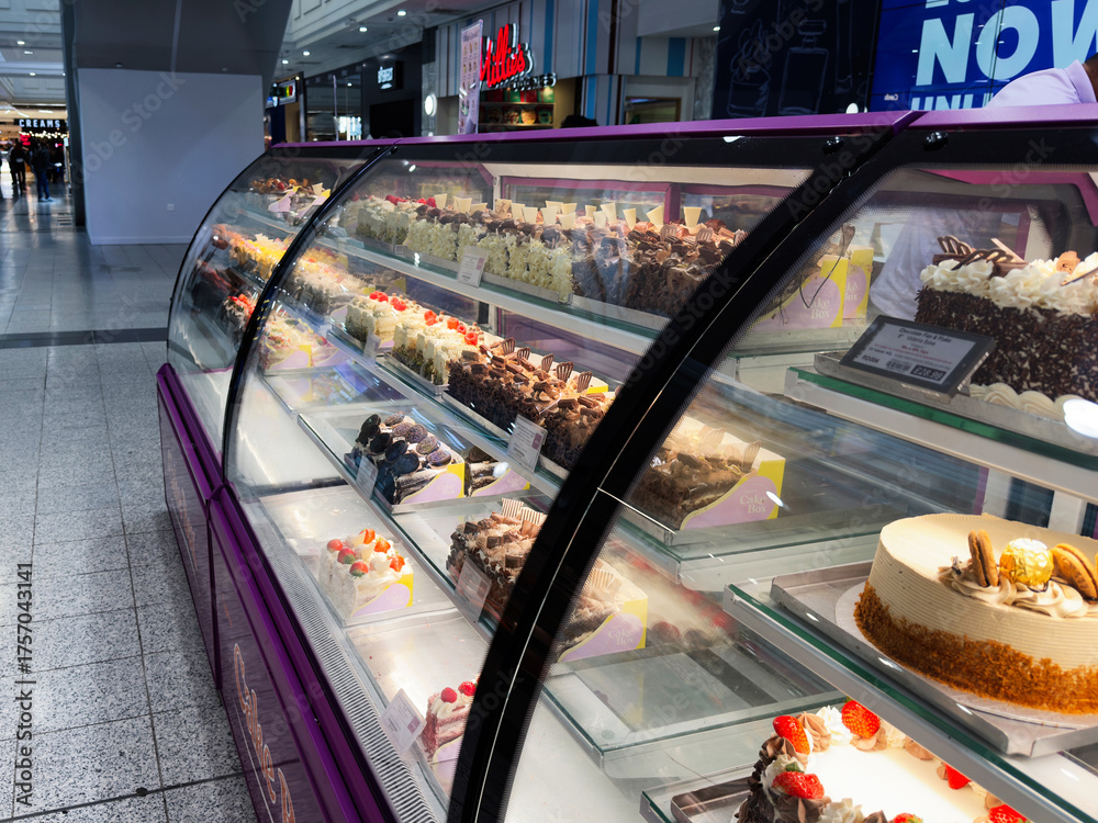 Bakery Eggfree Cake Box display case in a mall shop filled with cakes ...
