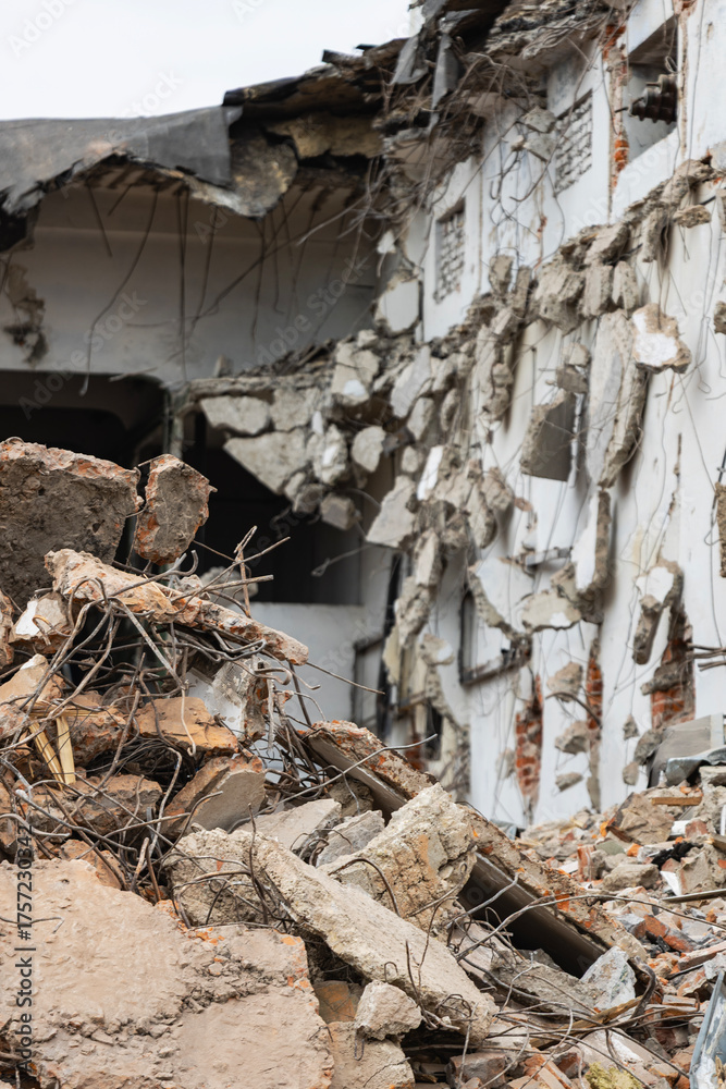 Demolition process in urban area shows debris and dismantled structure ...