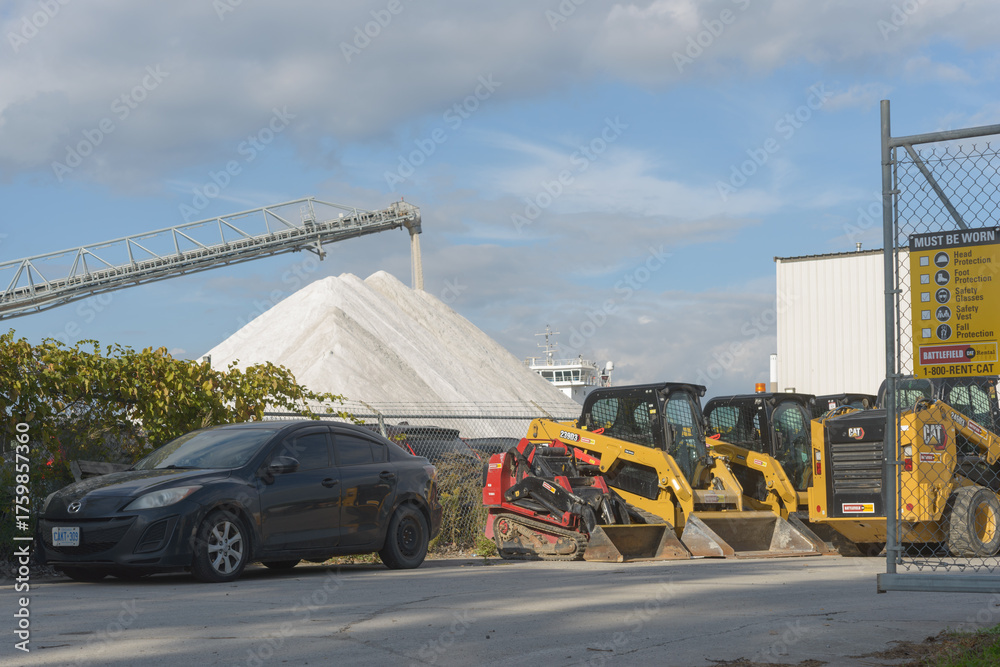 car, industrial machine park and unloading of salt cargo at Ship ...