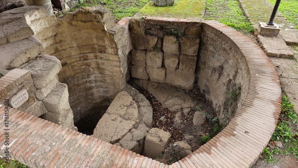 Rome, Italy - 13 January 2025. An ancient circular cistern with brick ...