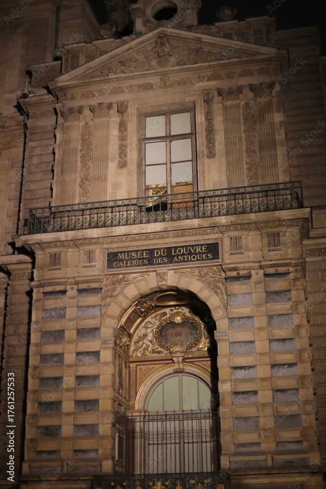A close-up of the facade of the Louvre Museum and a broken after the ...