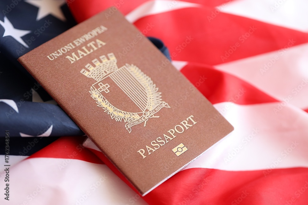 Malta passport on big waving flag of United States of America close up ...