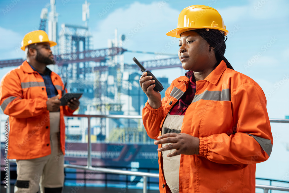 Offshore platform professional using hand portable radio device to ...