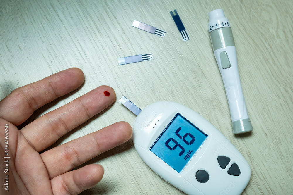hand of people check diabetes and high blood glucose monitor with ...