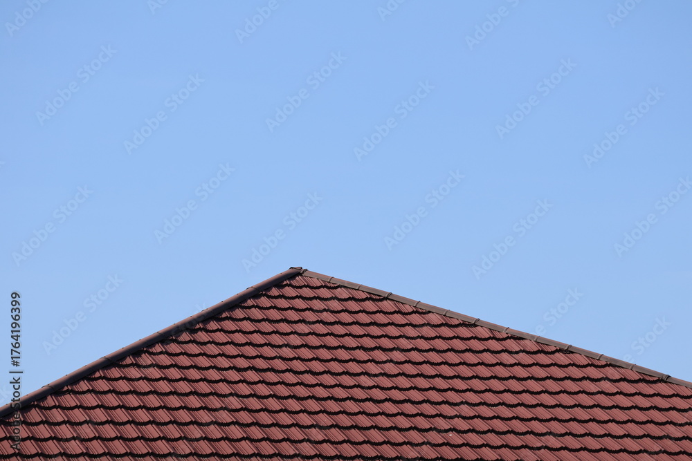 House roof with steel roofing sheet. Traditional metal shingle tiles ...