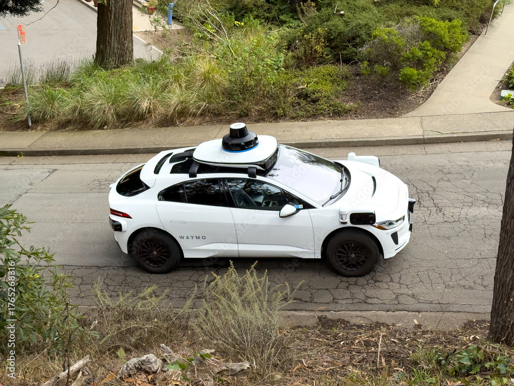 aymo autonomous Jaguar I-PACE electric self-driving car driving on ...