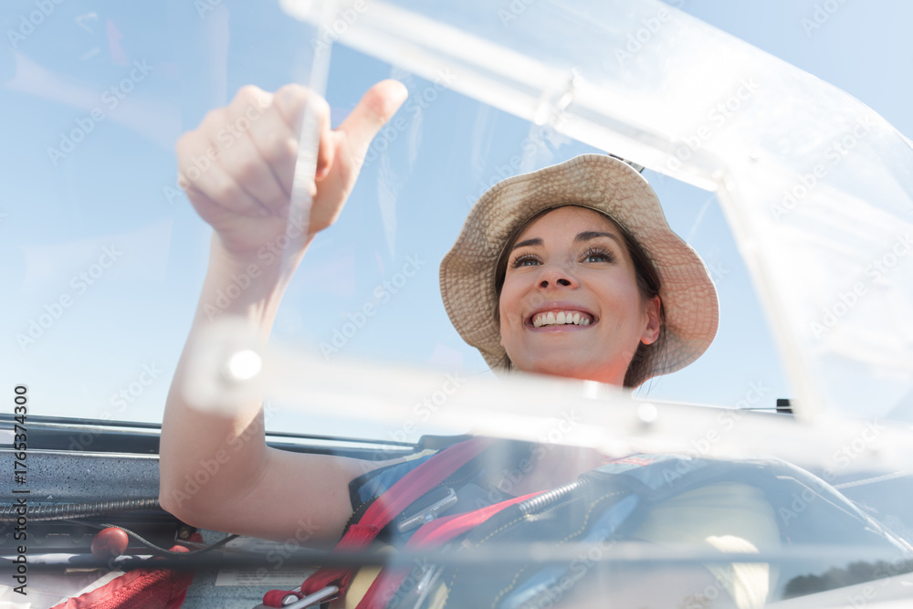 beautiful woman ready to fly with thumbs up Stock Photo | Adobe Stock