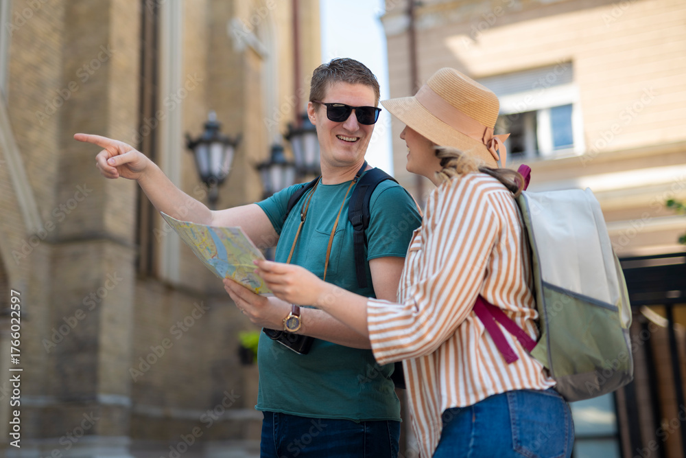 Couple traveling and navigating city with paper map Stock Photo | Adobe ...