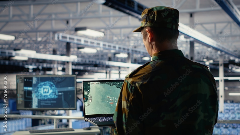 Military technician in data center tracking satellite coordinates using ...