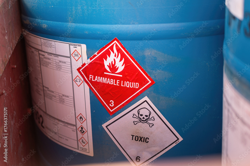 Flammable liquid warning sign on the chemical containment gallon ...