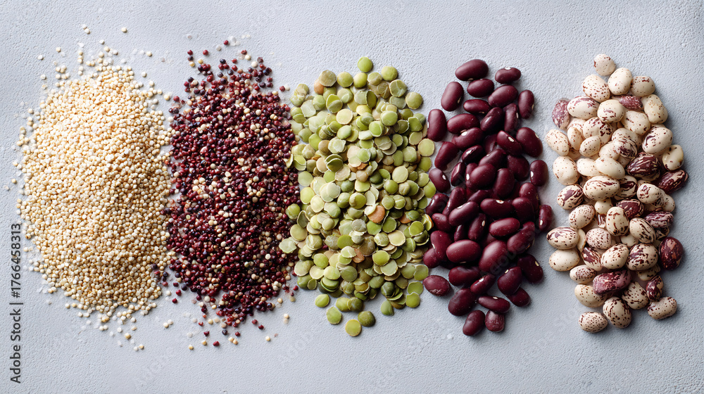 Five distinct piles of various dry grains and legumes, including quinoa ...