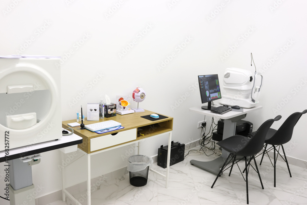 Modern autorefractor with monitor, keyboard, and mouse in a white ...