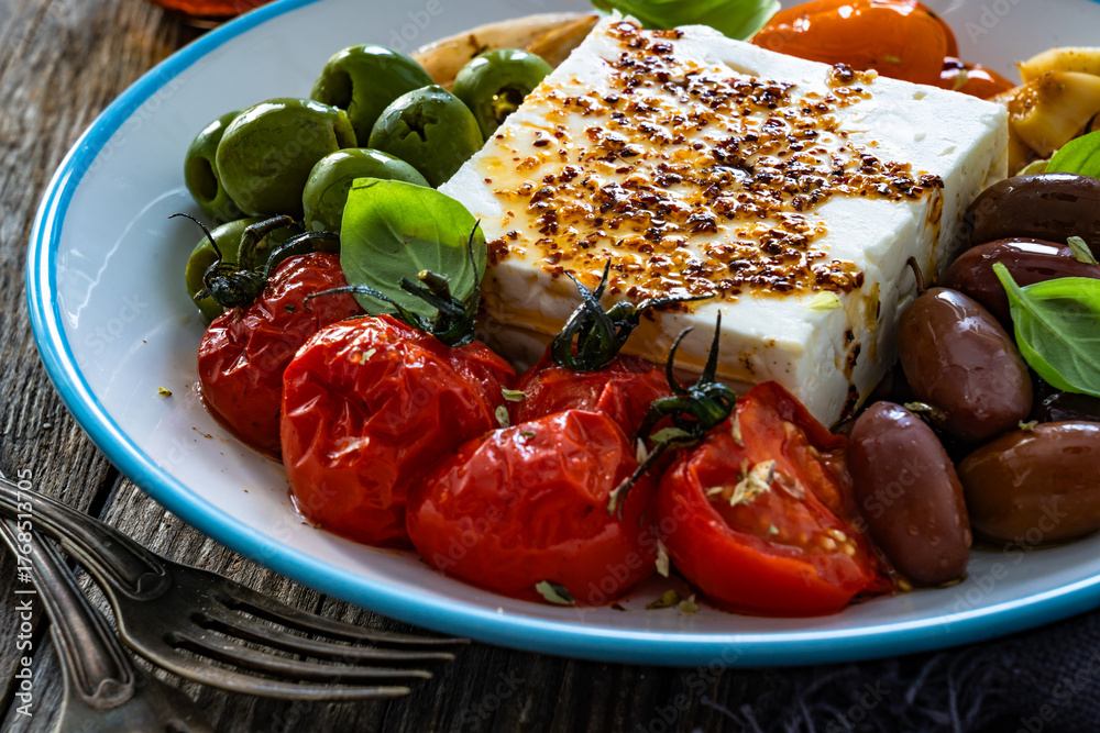 Greek style appetizer - feta cheese with olives and grilled tomatoes ...