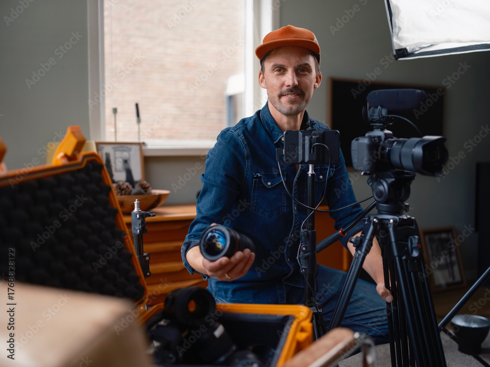 Filmmaker operating camera with microphone for professional audio ...