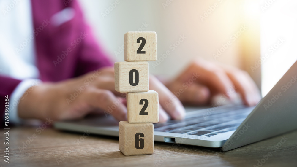 Transition from 2025 to 2026 with wooden blocks. Business goals for the ...