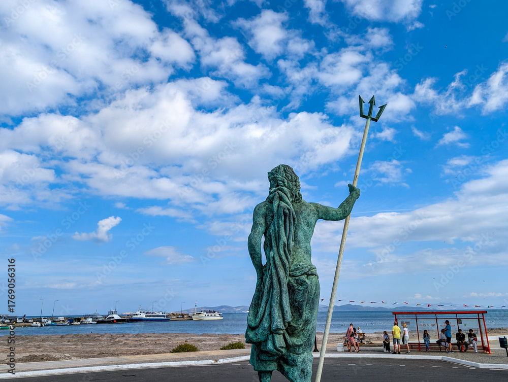 The sea god Poseidon, statue at the port of Mastichari, a coastal town ...