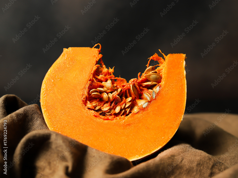 Pumpkin Slice Macro on Dark Fabric Stock Photo | Adobe Stock